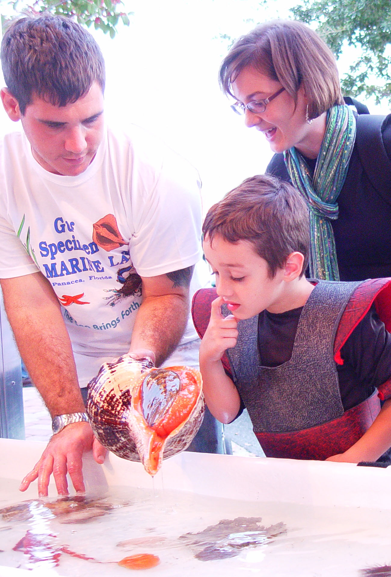 4.Cypress_Rudloe_with_kid_and_conch_October_28,_2011